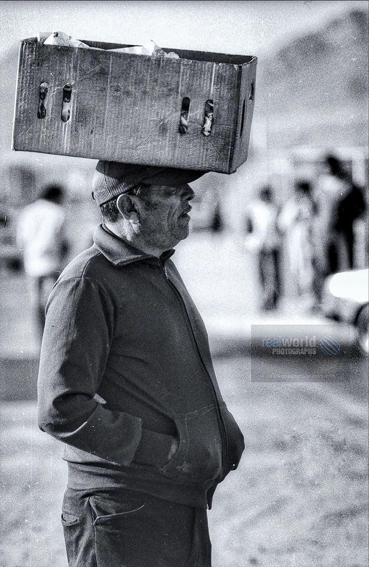 A man balances a box on his head in Chihuahua, Mexico in 1992. Gary ...
